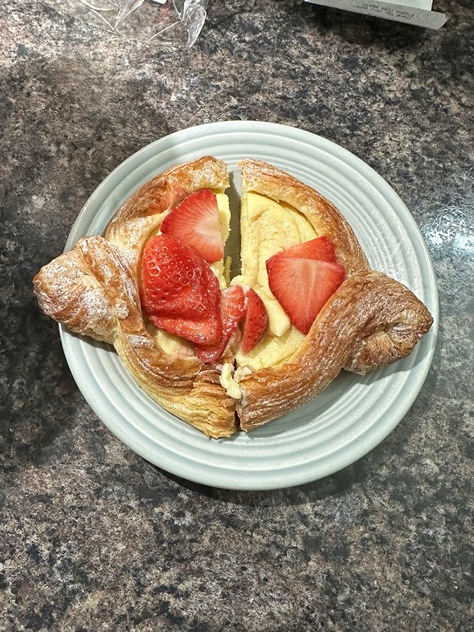 This strawberry danish isn't just breakfast&mdash;it's edible architecture. Flaky layers cradle fresh berries like they're precious jewels rather than fruit.