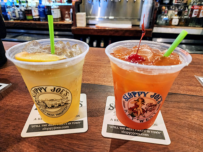 Two plastic cups of liquid sunshine&mdash;one golden, one sunset orange&mdash;ready to transform strangers into friends and inhibitions into distant memories.