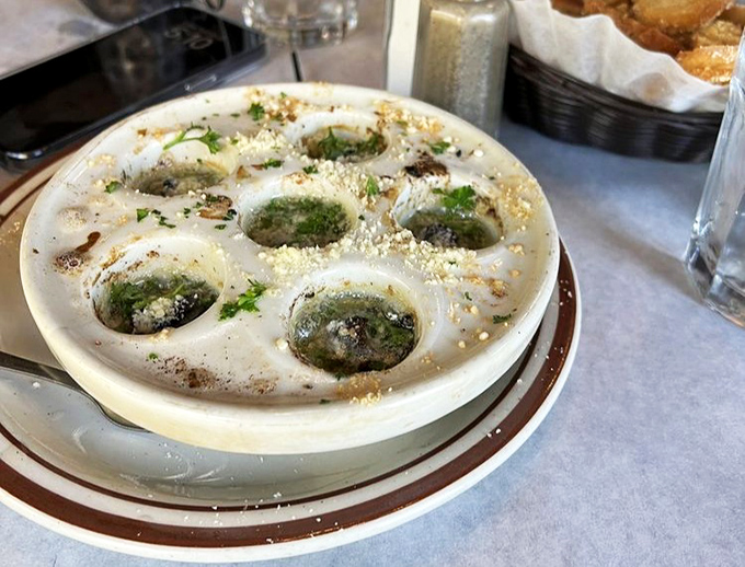 Escargot that would make Julia Child nod in approval. These aren't garden snails with delusions of grandeur&mdash;they're the real deal, swimming in buttery, garlicky goodness.