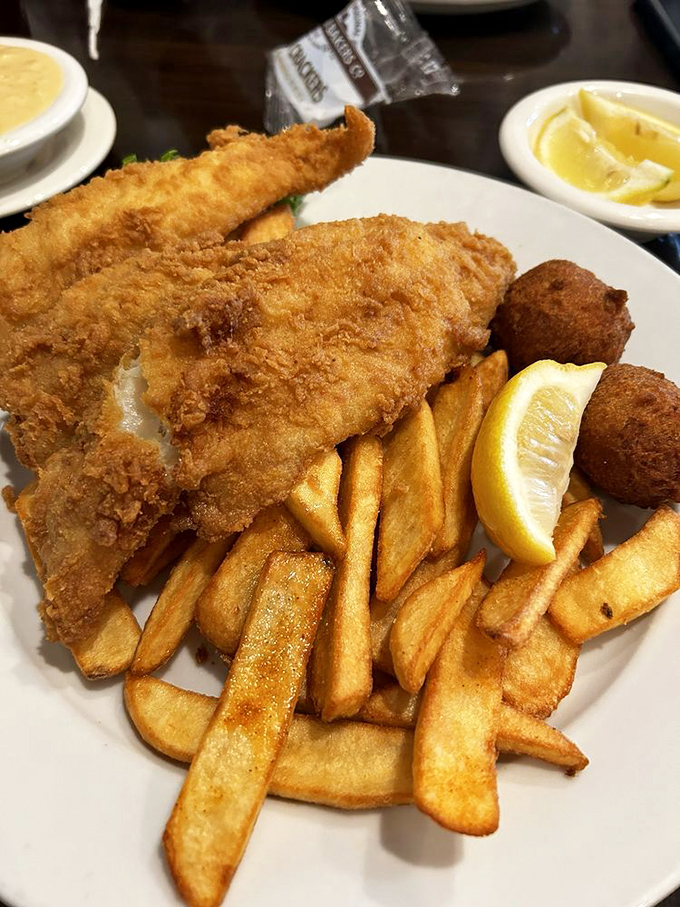 Golden, crispy fish that would make Neptune himself swim to shore. These aren't just fish and chips—they're an edible postcard from the coast.