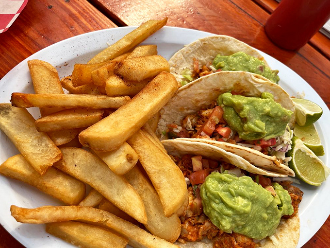 Fish tacos done right: crispy on the outside, tender within, topped with enough avocado to make a Californian nod in approval.