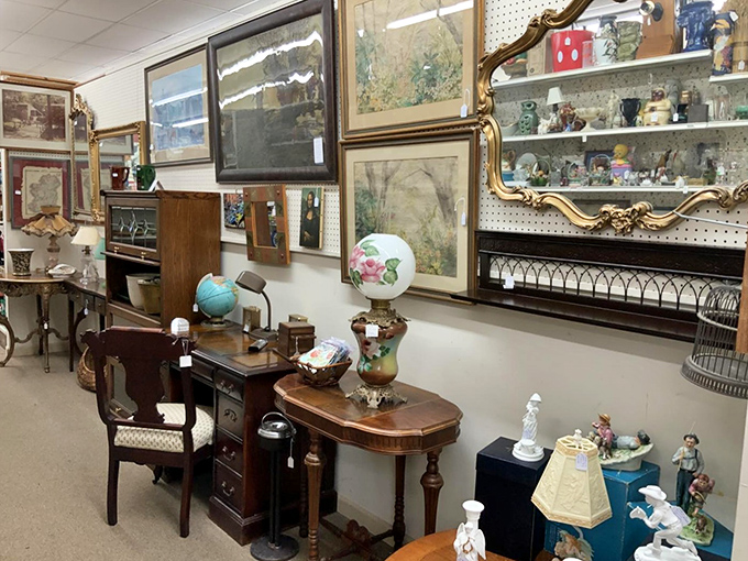 Where antique furniture meets vintage art in perfect harmony. That gilded mirror has definitely seen things it can't unsee.