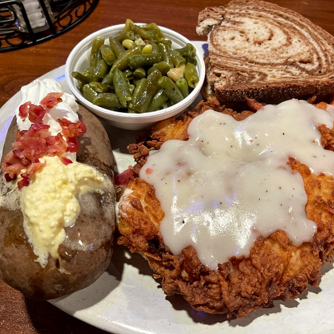 This isn't just chicken fried chicken&mdash;it's a crispy, golden masterpiece under a blanket of country gravy that would make angels weep.