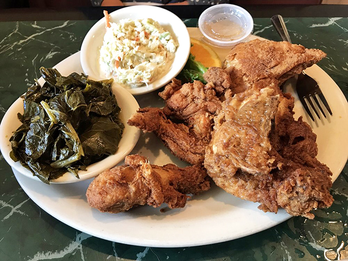 Fried chicken so perfectly golden it belongs in Fort Knox. The collards and potato salad aren't sidekicks&mdash;they're co-stars in this Southern trilogy.