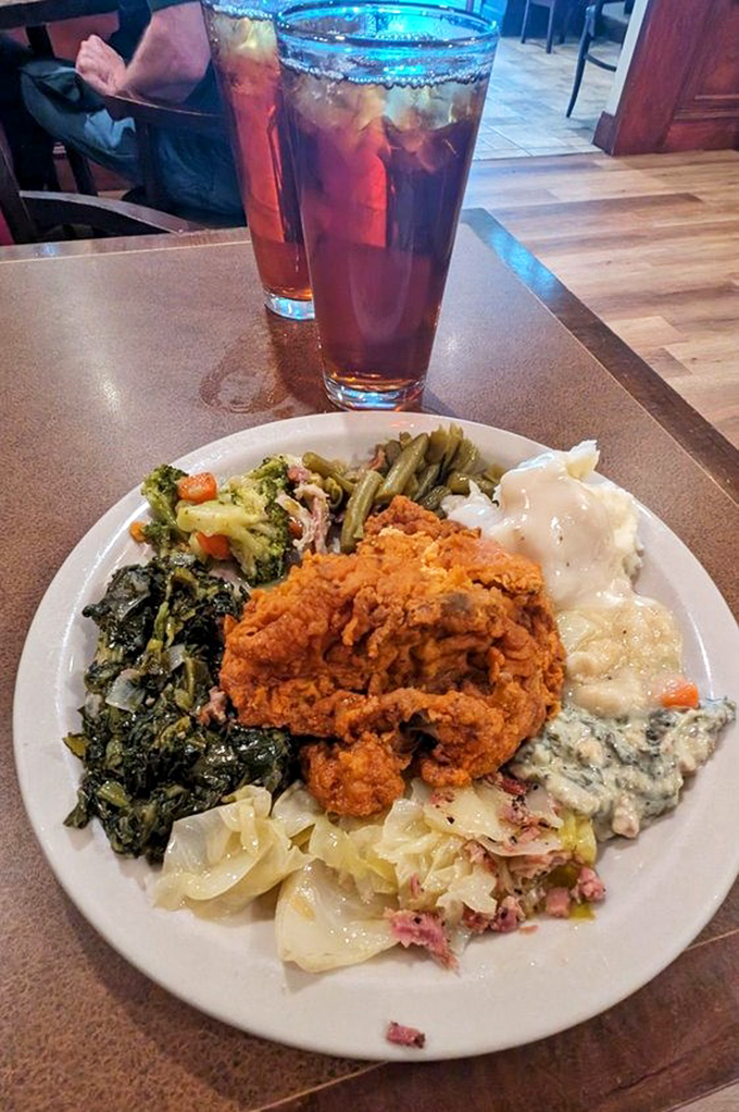 A plate that tells Kentucky's story&mdash;crispy fried chicken center stage, surrounded by supporting actors of collards, cabbage, and other garden treasures.