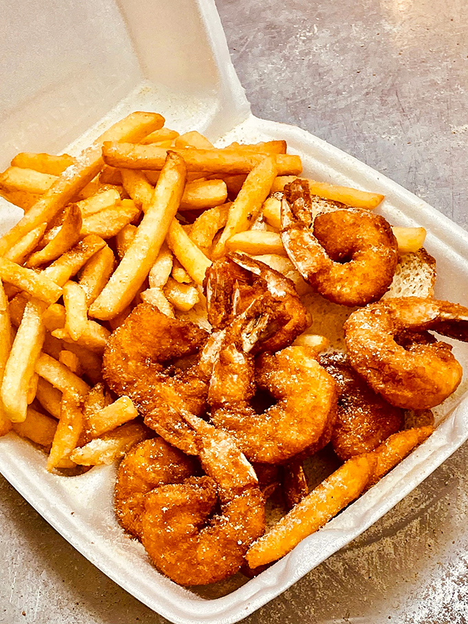 These shrimp aren't just fried&mdash;they're transformed. Like tiny golden treasures nestled beside fries that are clearly their perfect companions.