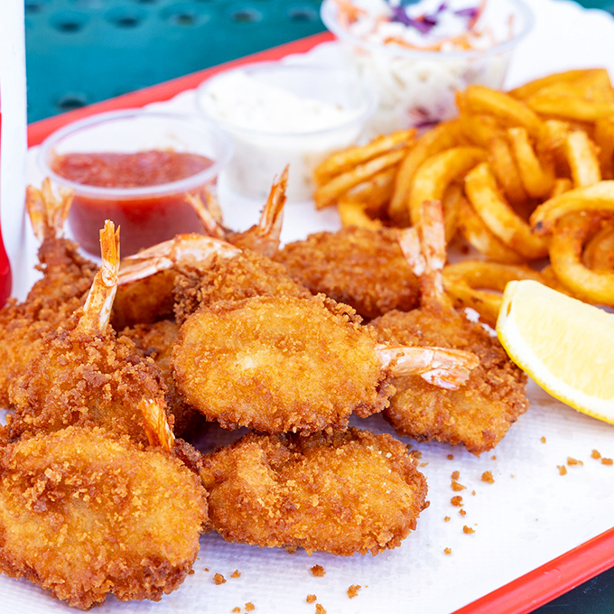 Golden-fried shrimp that crunch like autumn leaves, served with fries that could make a Frenchman weep with joy.