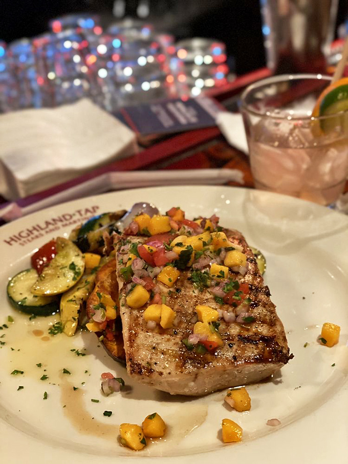 Fish that doesn't feel like the consolation prize. This mango-topped mahi-mahi proves Highland Tap isn't just about beef.