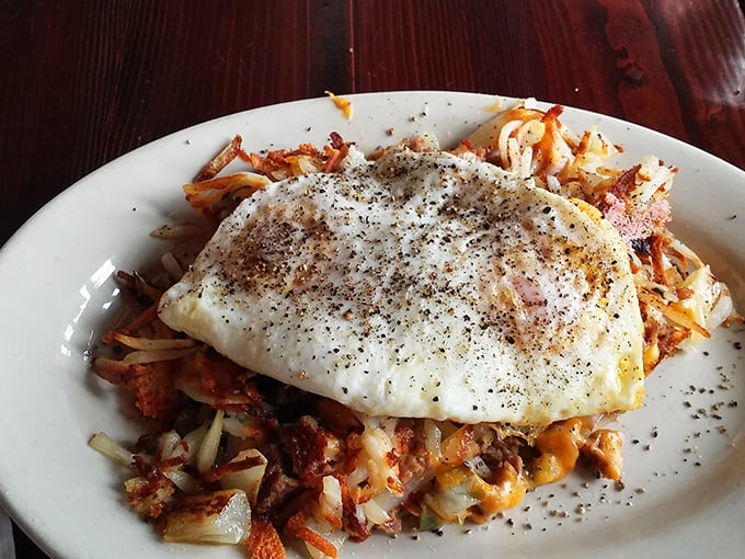 Eggs perched royally atop a kingdom of savory hash. This is the breakfast equivalent of hitting the Minnesota lottery&mdash;twice.