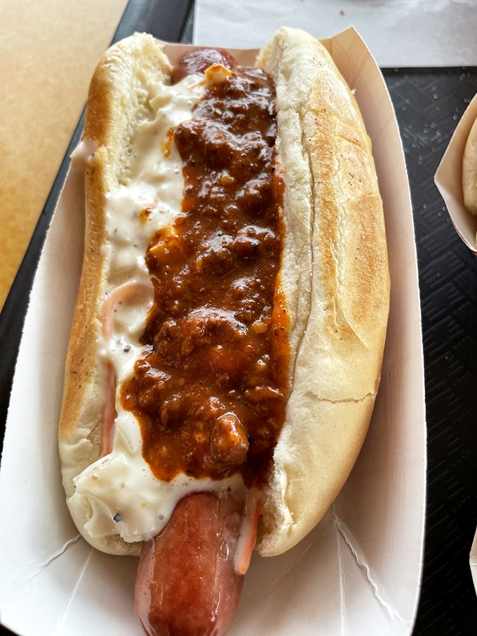 Not just any hot dog&mdash;this chili-slathered masterpiece demands both napkins and respect. The perfect balance of snap, spice, and soul.