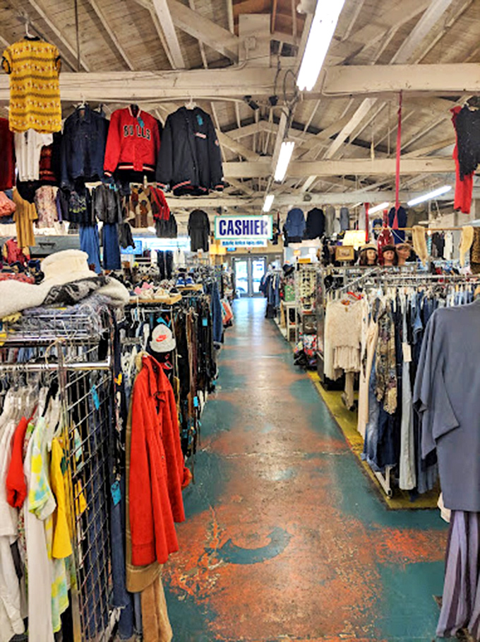 A Zoltar fortune-telling machine stands guard between departments, offering mystic predictions alongside your vintage shopping adventure. 