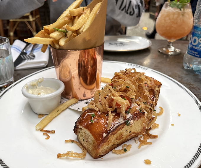 The lobster roll arrives like a celebrity &ndash; perfectly dressed, ready for its close-up, and surrounded by a golden entourage of fries.
