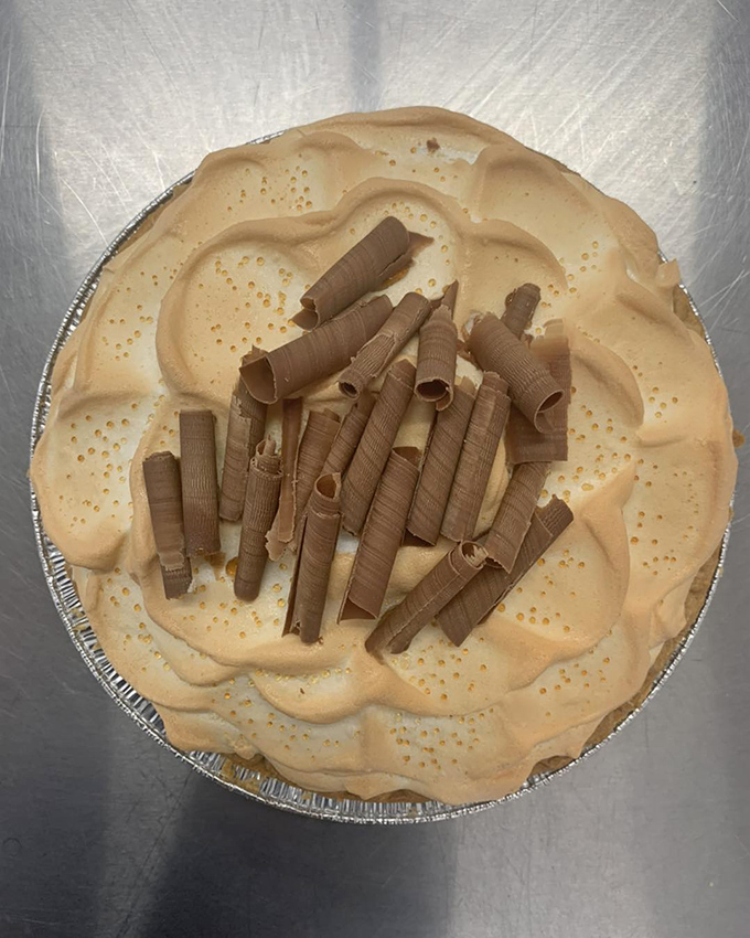 Towering meringue peaks shelter chocolate curls like a sweet igloo. This pie doesn't need fancy garnishes to steal the spotlight.