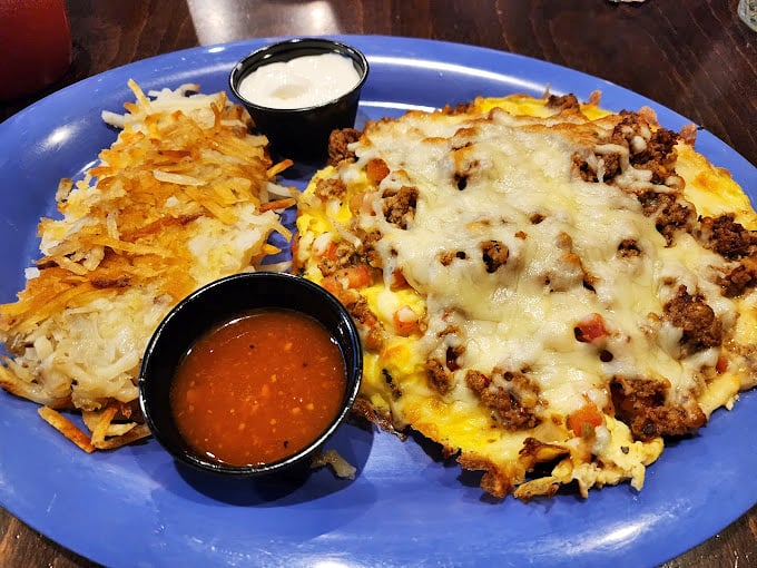 This isn't just an omelet&mdash;it's a masterclass in breakfast architecture, with golden cheese and savory fillings that demand your full attention.