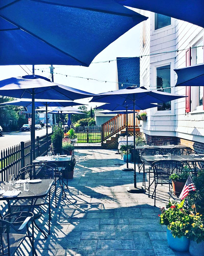 Heirloom's outdoor patio combines coastal charm with serious dining. Those blue umbrellas aren't just for show&mdash;they're sheltering taste sensations that might make you momentarily forget about the beach.