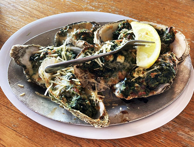 These Oysters Rockefeller aren't just appetizers; they're little seafood thrones topped with a crown of spinach and cheese fit for Neptune himself.