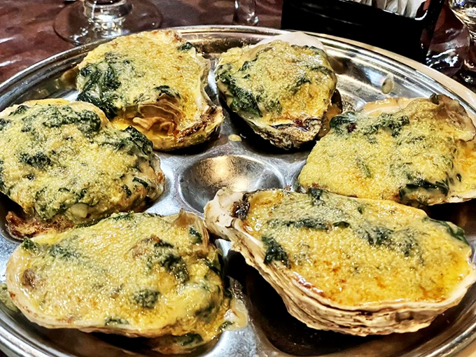 These Oysters Rockefeller are dressed better than most people at the opera - spinach and cheese elevating seafood to rock star status.