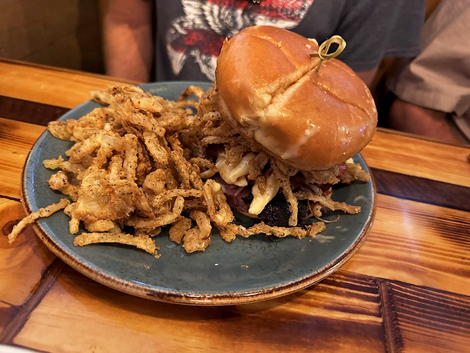 This isn't just a sandwich; it's an engineering marvel of smoked meat and crispy toppings. Architecture you can eat.