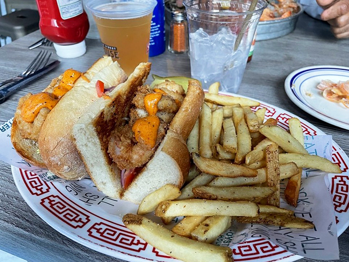 This po' boy isn't just a sandwich; it's a commitment to happiness&mdash;crispy shrimp, soft bread, and fries that clearly didn't come from a freezer bag.