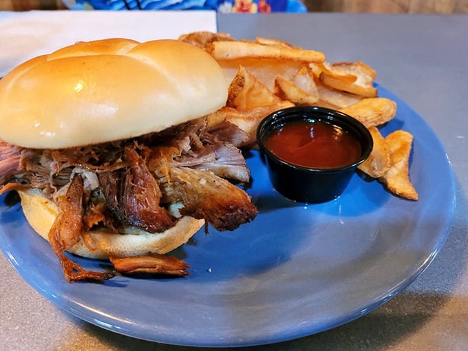 That pulled pork sandwich isn't messing around. Tender meat piled high on a soft bun with house-made chips&mdash;road trip fuel of champions.