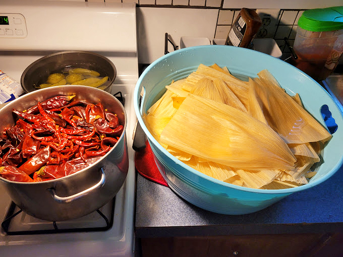 The magic behind the meal: dried chiles ready for transformation and corn husks awaiting their filling. This is where the alchemy happens.