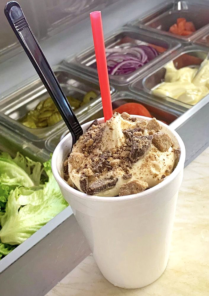 Peanut butter cup milkshake perfection beside fresh ingredients. The dichotomy of decadence and wholesome&mdash;America in a cup.