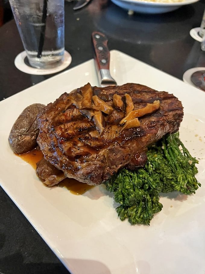 This ribeye isn't just dinner&mdash;it's performance art with a side of broccolini. The kind of steak that makes vegetarians momentarily question their life choices.