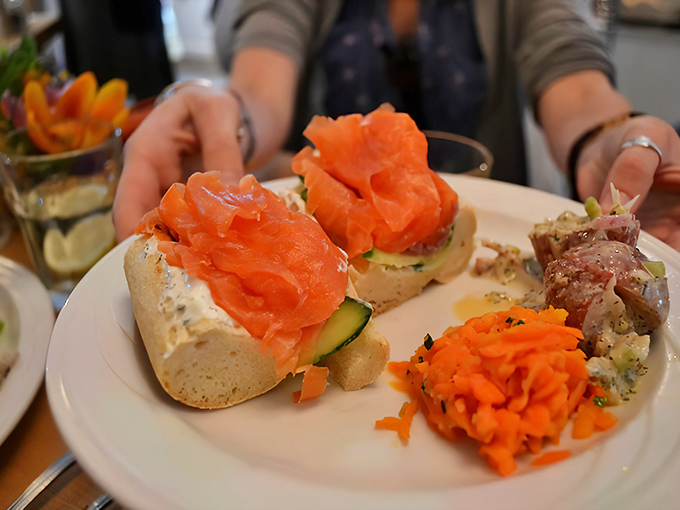 Salmon that clearly went to finishing school&mdash;elegantly presented on crusty bread with cucumber and a carrot slaw sidekick.