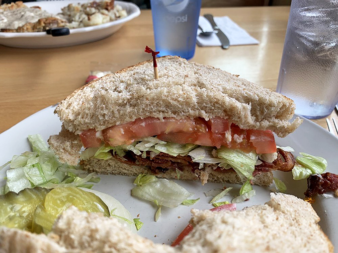 This isn't just a BLT &ndash; it's a masterclass in sandwich engineering, where thick-cut bacon and garden-fresh veggies find harmony between slices of house-made bread. 