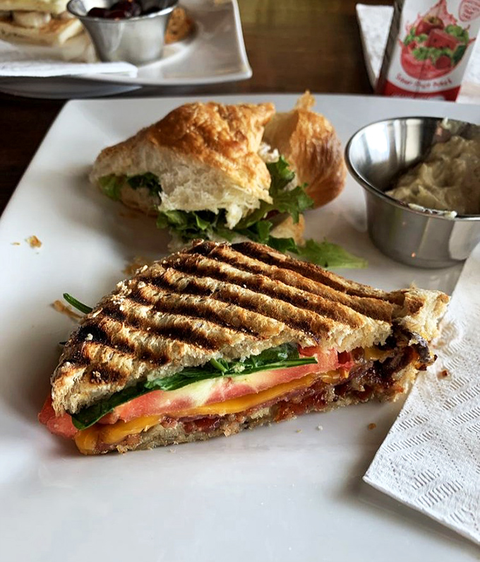 The grilled sandwich isn't just lunch&mdash;it's architecture. Layers of cheese, tomato, and greens create the Taj Mahal of midday meals, complete with soup sidekick.