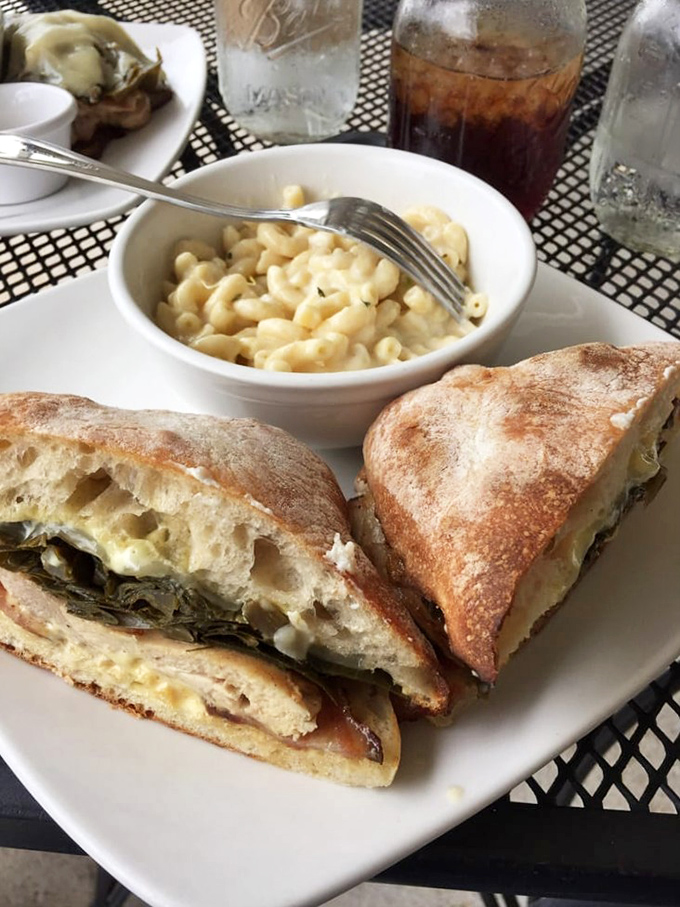 A sandwich that demands to be eaten with both hands and your full attention. The mac and cheese side dish is basically childhood nostalgia in a bowl.