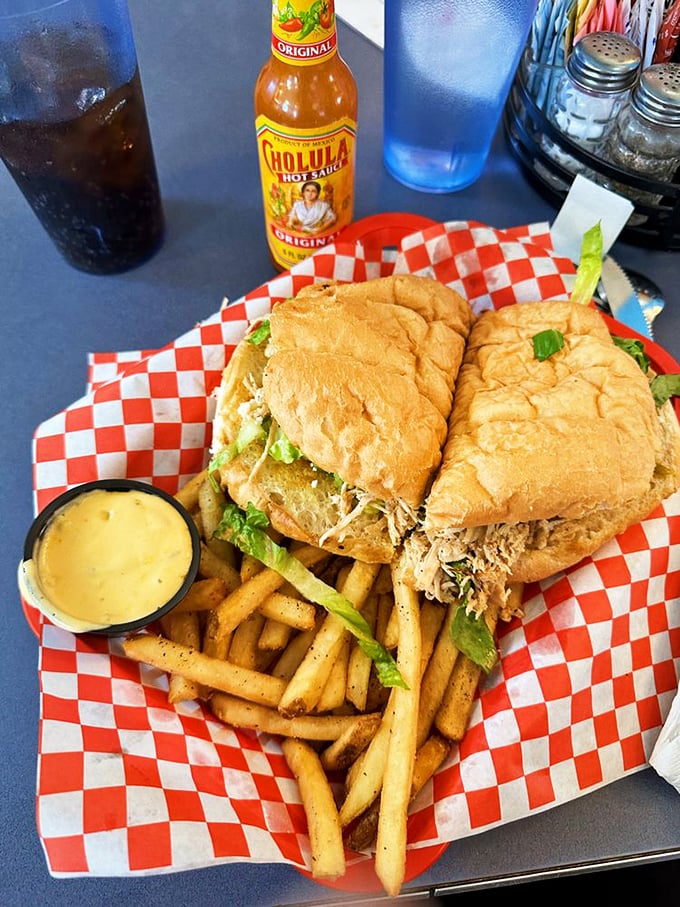 This sandwich isn't just lunch, it's an event. Paired with a bottle of Cholula and crispy fries, it's the midday hero we all deserve.