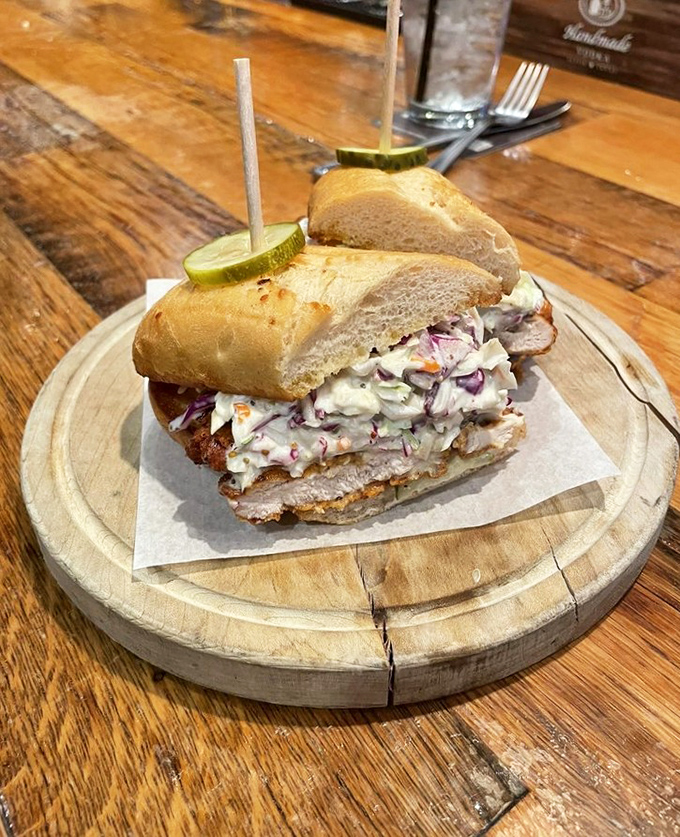 This sandwich isn't just tall&mdash;it's skyscraper ambitious. Crispy chicken and creamy slaw creating the kind of harmony that makes taste buds sing opera.