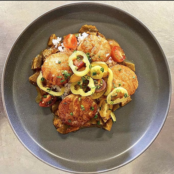 Golden-brown perfection meets artistic presentation. These aren't just scallops&mdash;they're little discs of oceanic bliss that somehow found their way to landlocked Indiana.