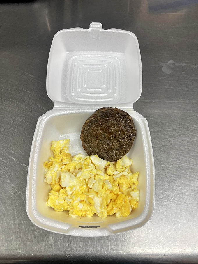 Breakfast of champions, Indiana-style. Golden scrambled eggs and a seasoned sausage patty&mdash;simple food done right beats fancy brunch any day of the week.