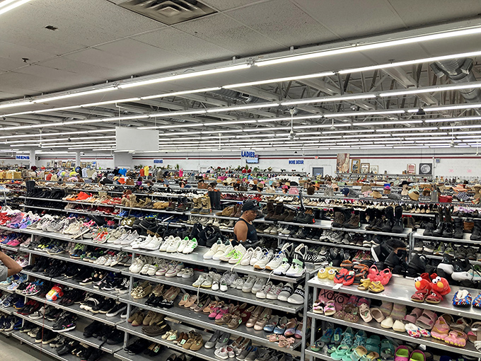 The shoe section stretches toward the horizon like a footwear fever dream. Finding your size has never felt more like an archaeological expedition.