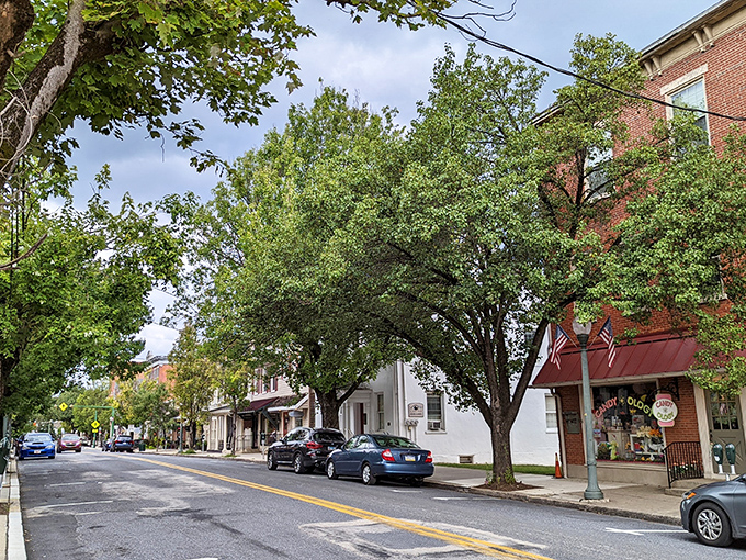 Tree-lined streets shade the colorful storefronts of Lititz's shopping district, where "retail therapy" actually feels therapeutic rather than traumatic.