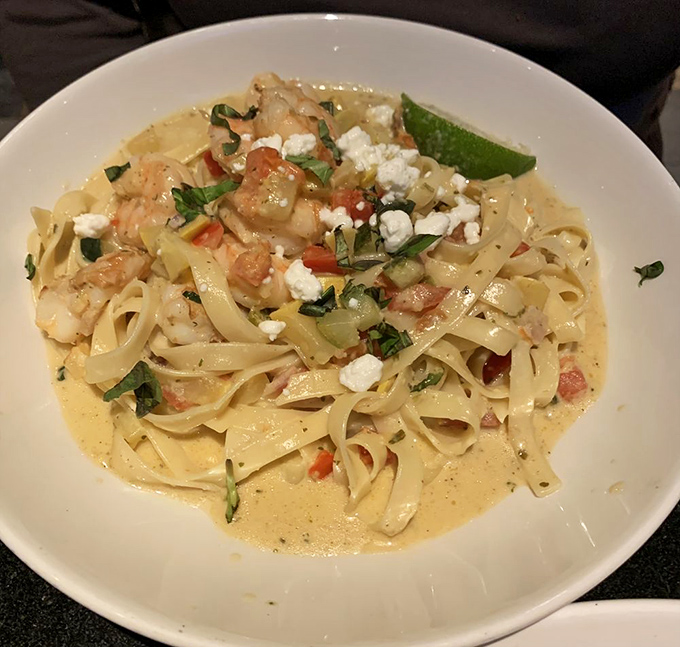 Pasta that doesn't need a passport to transport you to coastal bliss &ndash; tender shrimp and fettuccine swimming in a sauce worth bottling.