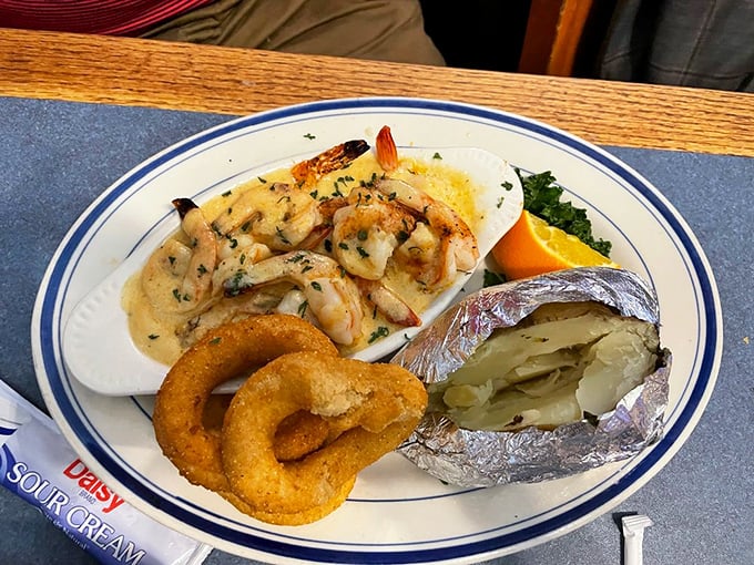 Shrimp scampi that doesn't hide behind excessive garlic butter, paired with those onion rings that deserve their own fan club.