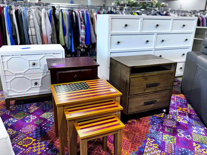 A patriotic nesting table set plays nicely with dresser companions, proving that in the thrift universe, eclectic pairings make the most interesting homes.