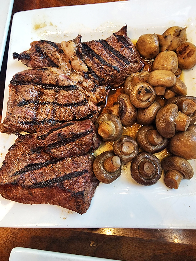 Perfectly charred steak with a supporting cast of mushrooms. This plate has caused more "food envy" across dining tables than any dish in Ohio.