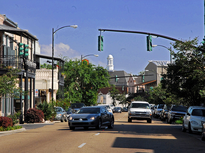 Main Street's vista captures the heart of small-town Louisiana – where church steeples still define the skyline and locals wave from porches.