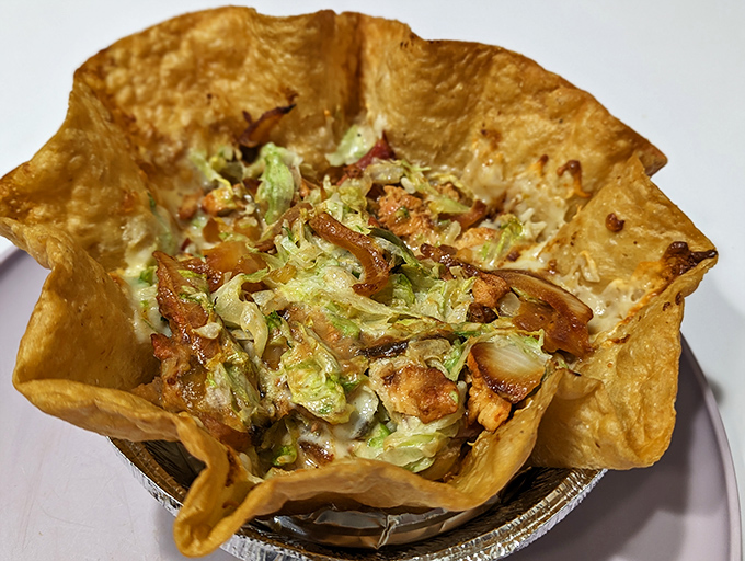 The taco salad shell isn't just edible architecture&mdash;it's the crispy golden throne upon which the kingdom of fresh ingredients rightfully sits.
