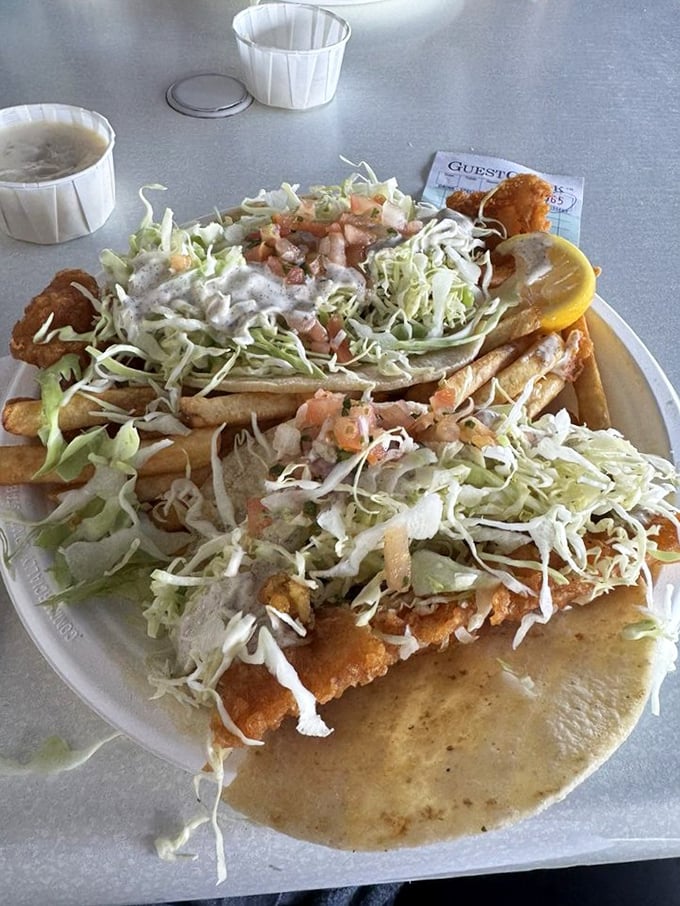 Fish tacos piled high with fresh slaw&mdash;proof that sometimes the best architectural achievements involve tortillas rather than concrete.
