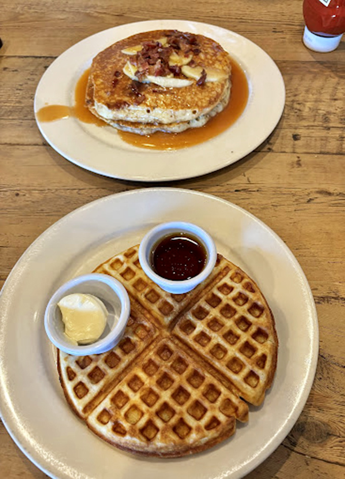 Waffles with perfect grid precision that would make architects weep. The butter and syrup cups&mdash;civilization's greatest contribution to breakfast engineering.