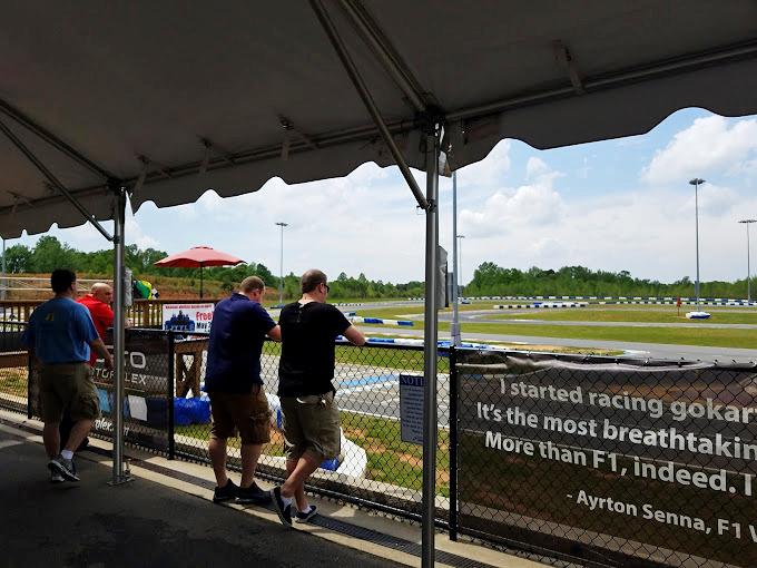 Spectators lean in, transfixed by the action. Nobody ever admits they're counting the seconds until it's their turn.