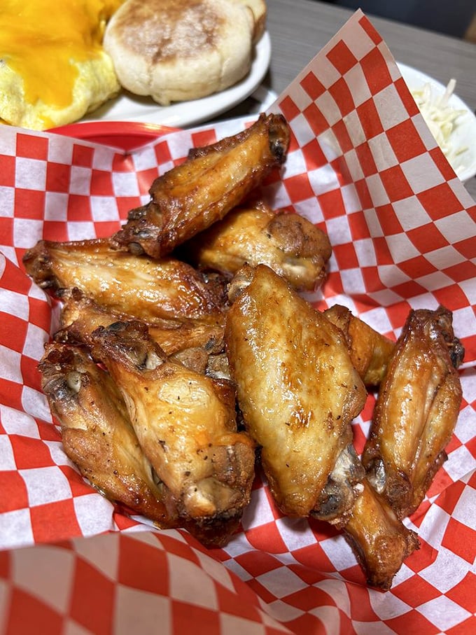 These wings aren't just done right, they're done righteous - crispy, glistening perfection served with classic checkered paper and zero pretension.