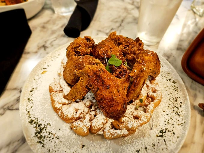 Fried chicken wings that make you question everything you thought you knew about poultry. The powdered sugar dusting is the plot twist you didn't see coming.