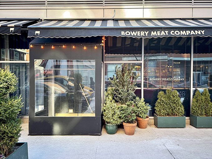 Bowery Meat Company's sleek storefront&mdash;where downtown cool meets carnivorous perfection. The James Dean of steakhouses.