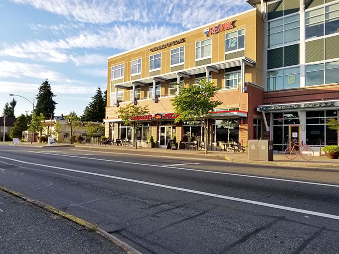 Urban development done right. Farrelli's bright storefront promises a slice of comfort in Tacoma's evolving landscape.